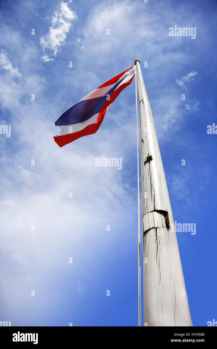 old flag of thailand holding up to beautiful blue sky with cloud Stock ...