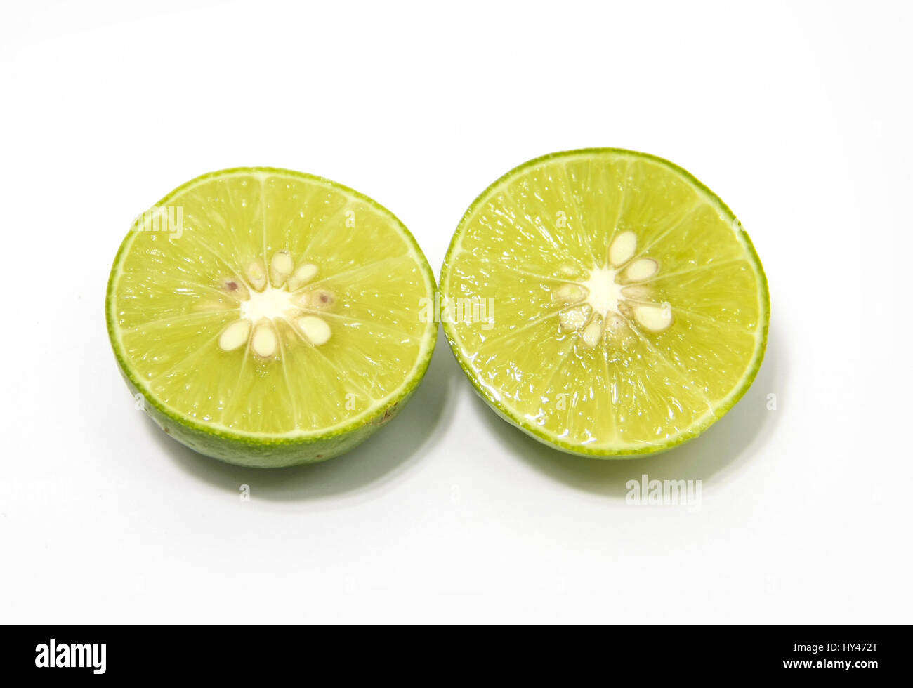 slice of green Lemons on white background Stock Photo - Alamy