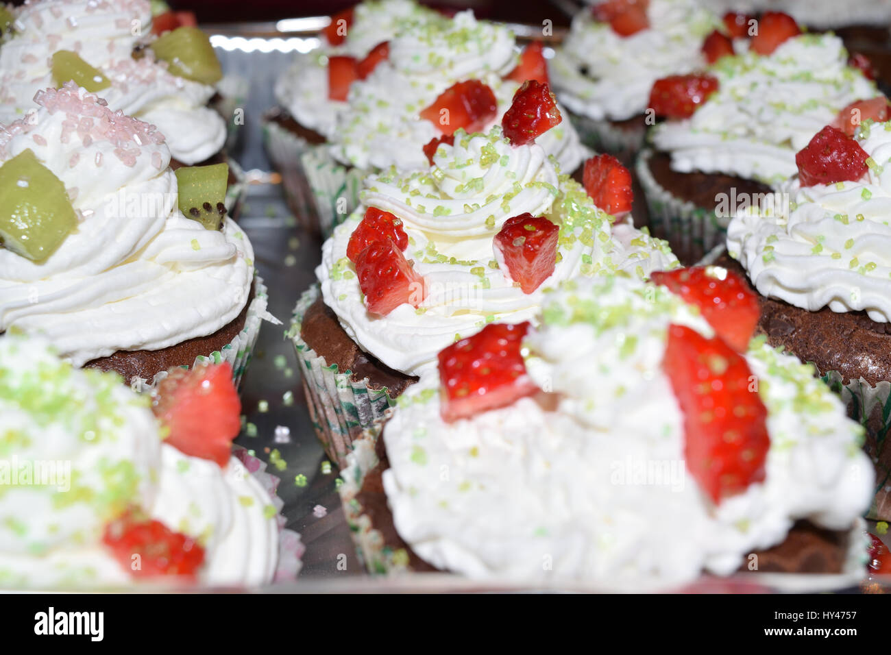 cup cakes with cream and various colorful decorations Stock Photo - Alamy