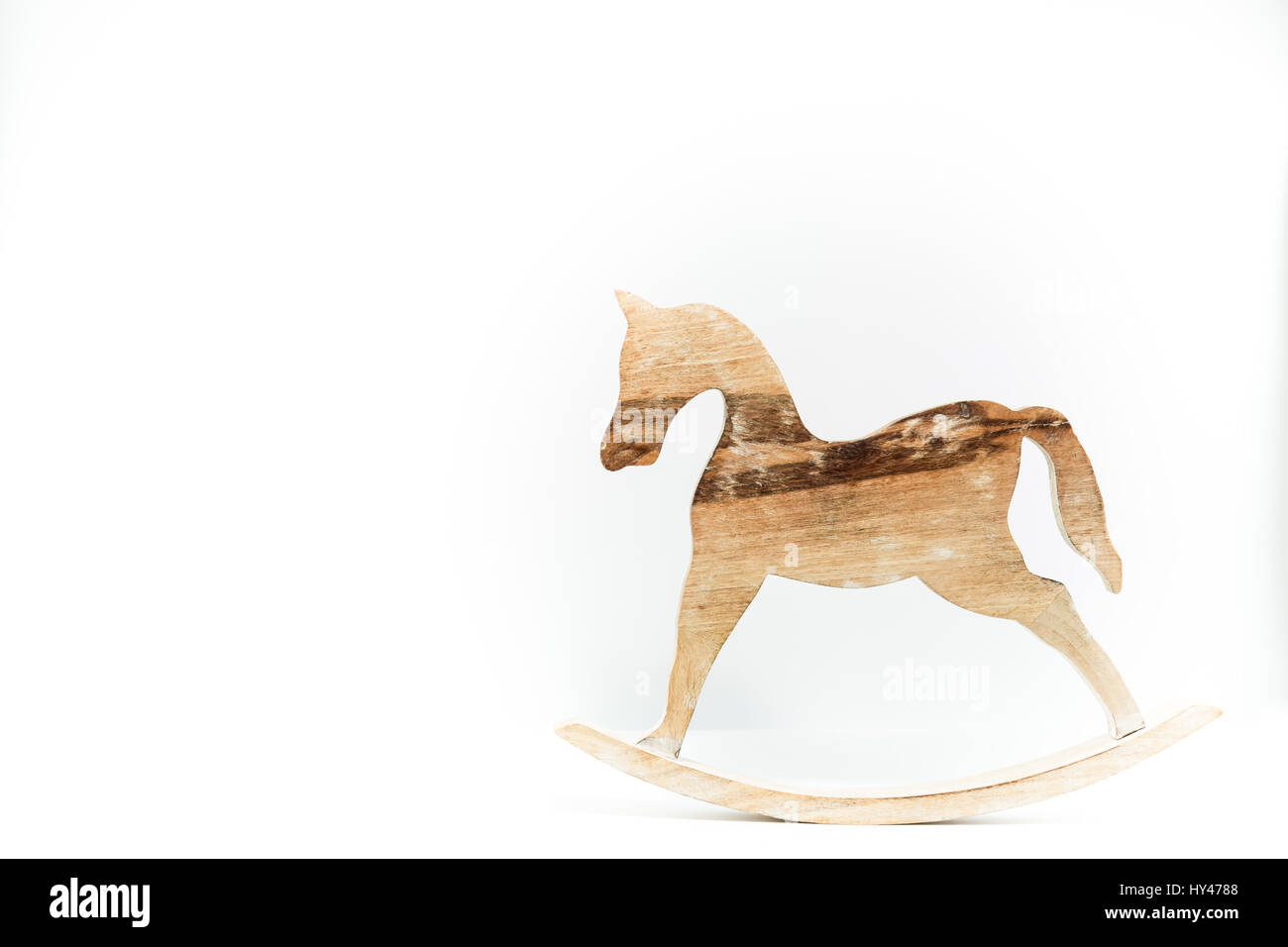 Rocking Horse carved on natural wood isolated on white background Stock ...