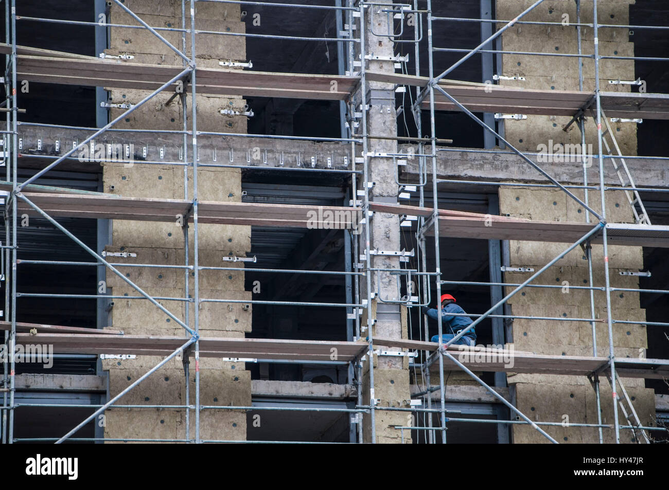 Low angle view of rows and columns of metal scaffolding over ...