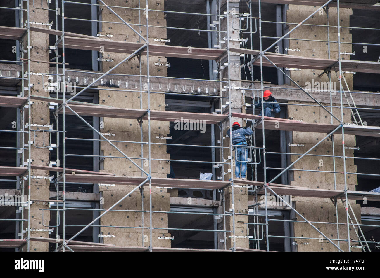 Low angle view of rows and columns of metal scaffolding over ...
