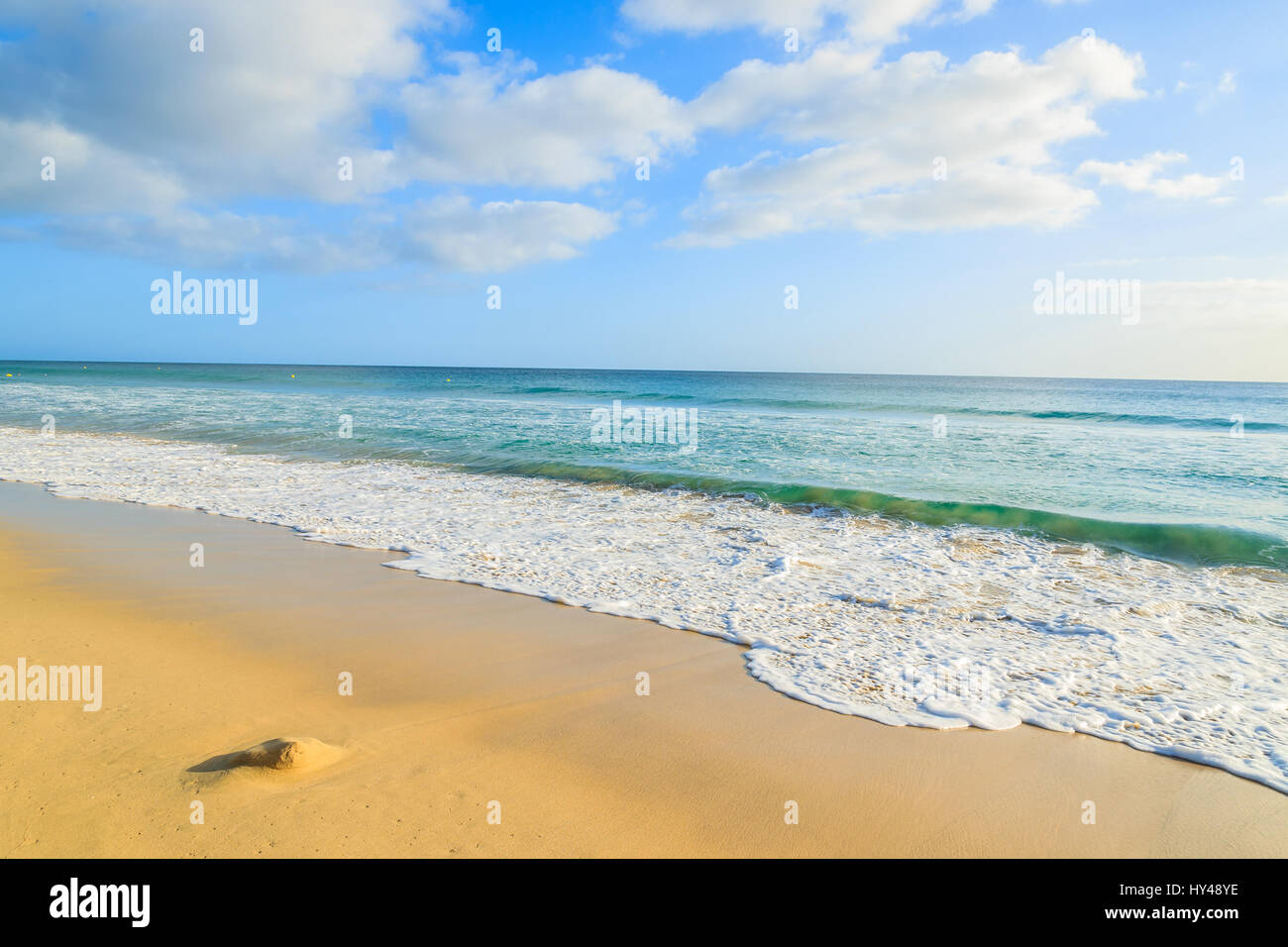 Ocean wave and golden sand beach on Jandia peninsula, Morro Jable ...