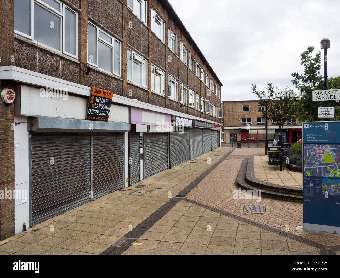 Empty shops shuttered up Stock Photo - Alamy