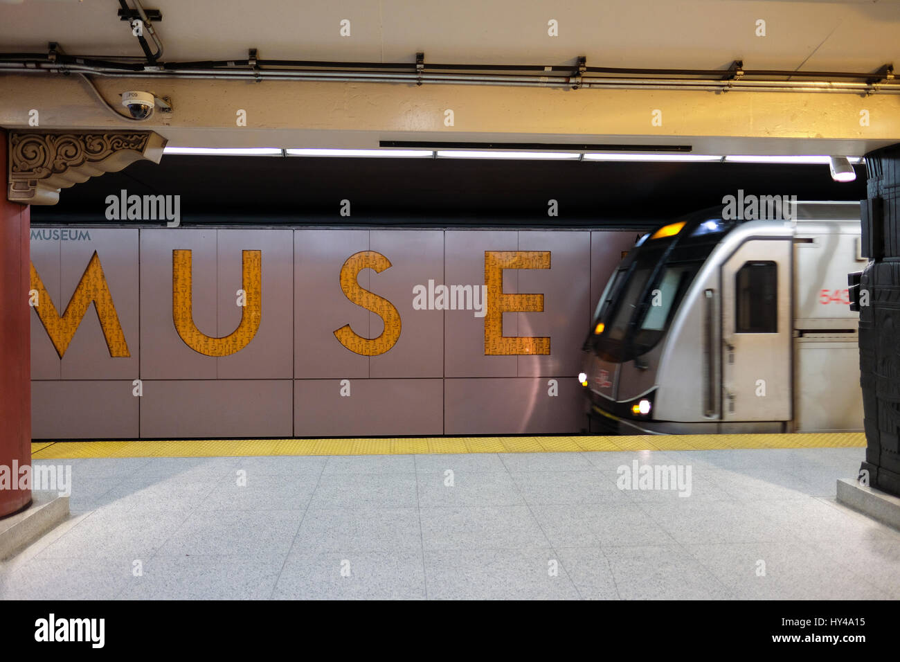 Train arriving at Museum subway station platform / metro station, tube ...