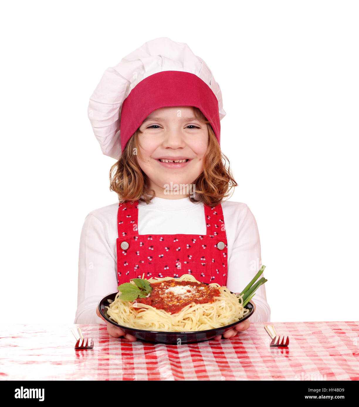 happy little girl cook with spaghetti on table Stock Photo - Alamy