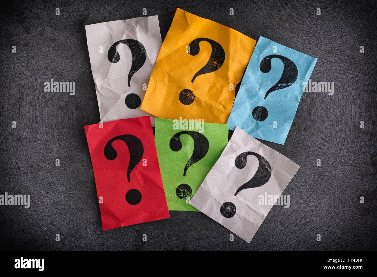 Crumpled colorful paper notes with question marks. Close up Stock Photo ...
