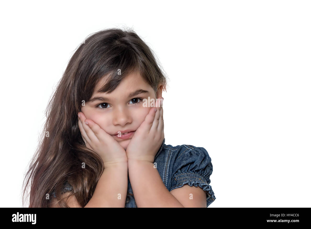 Portrait of expecting surprises brunette long haired little girl ...