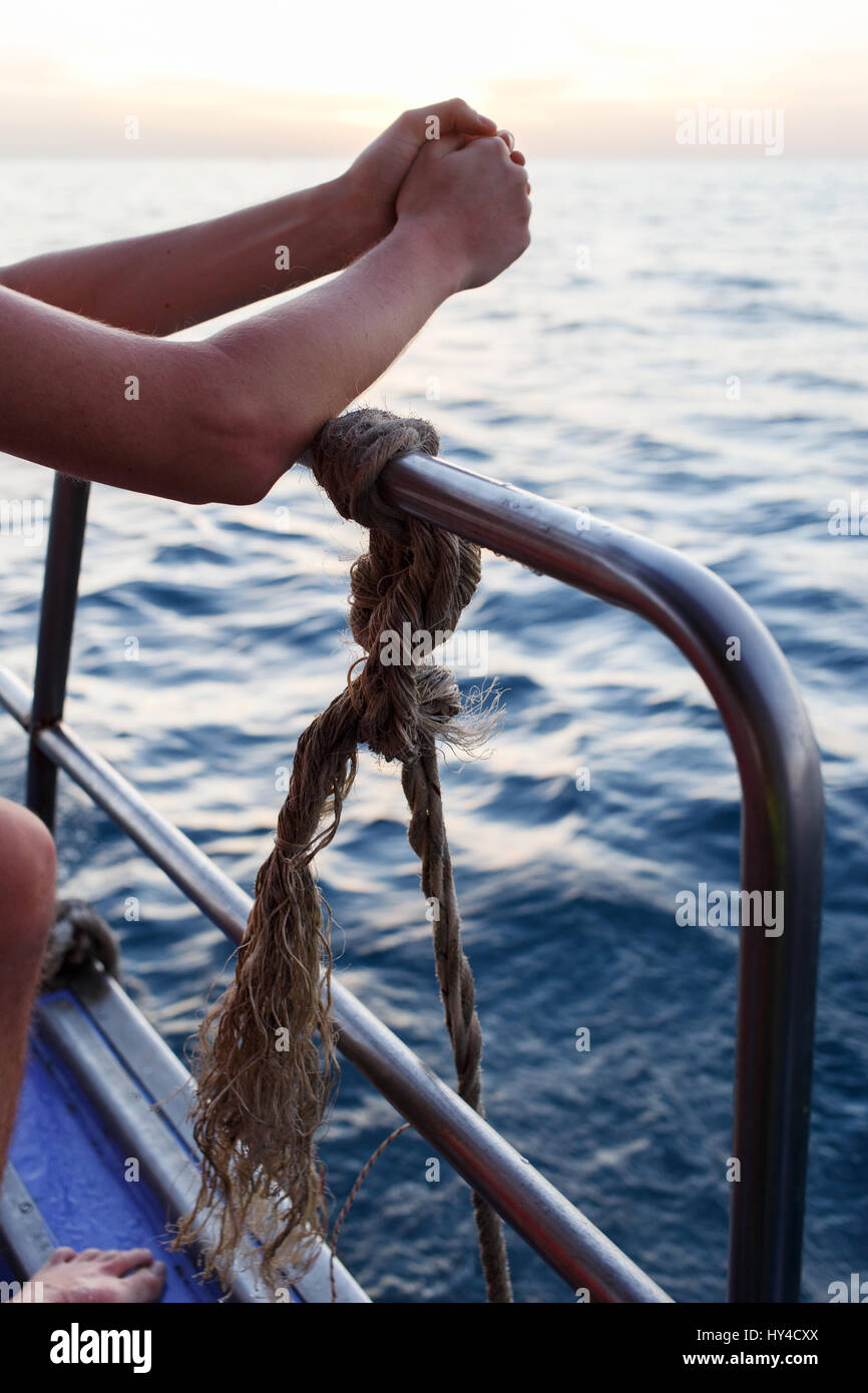 Man standing next to rope Stock Photo - Alamy