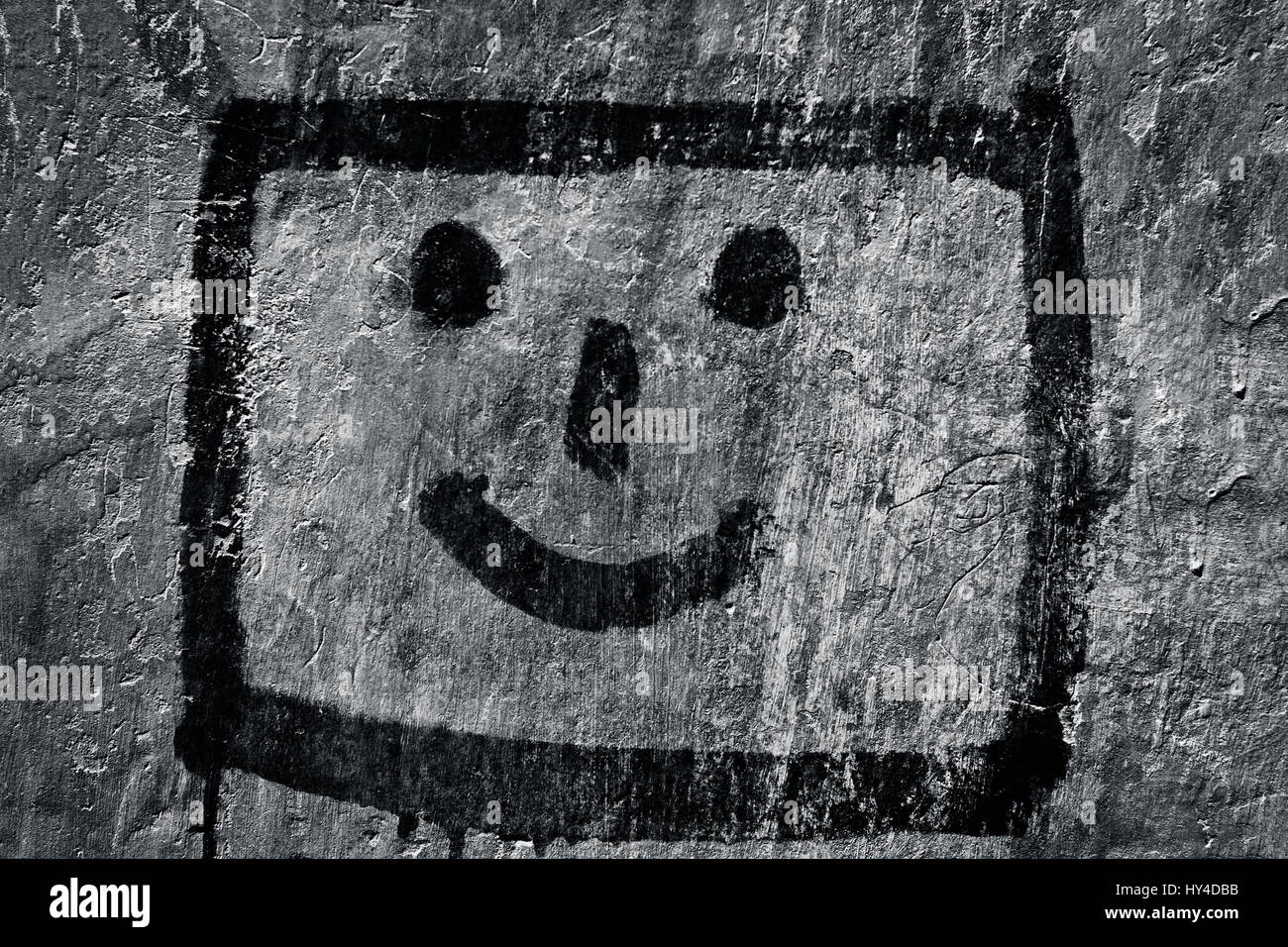 Funny faces drawn on a surface Stock Photo - Alamy