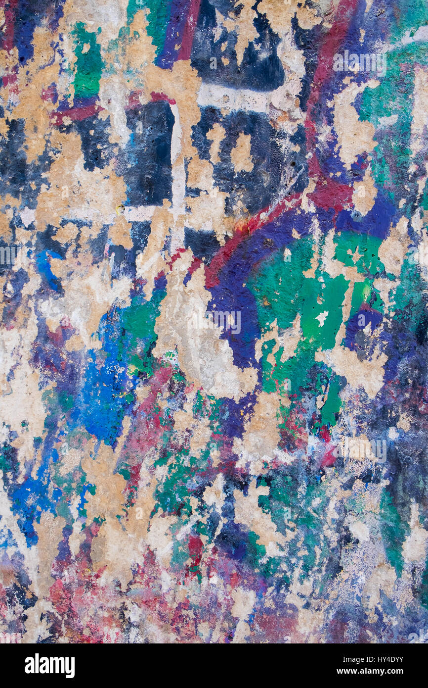 Old graffiti on a cement wall has a very unique texture after years and ...