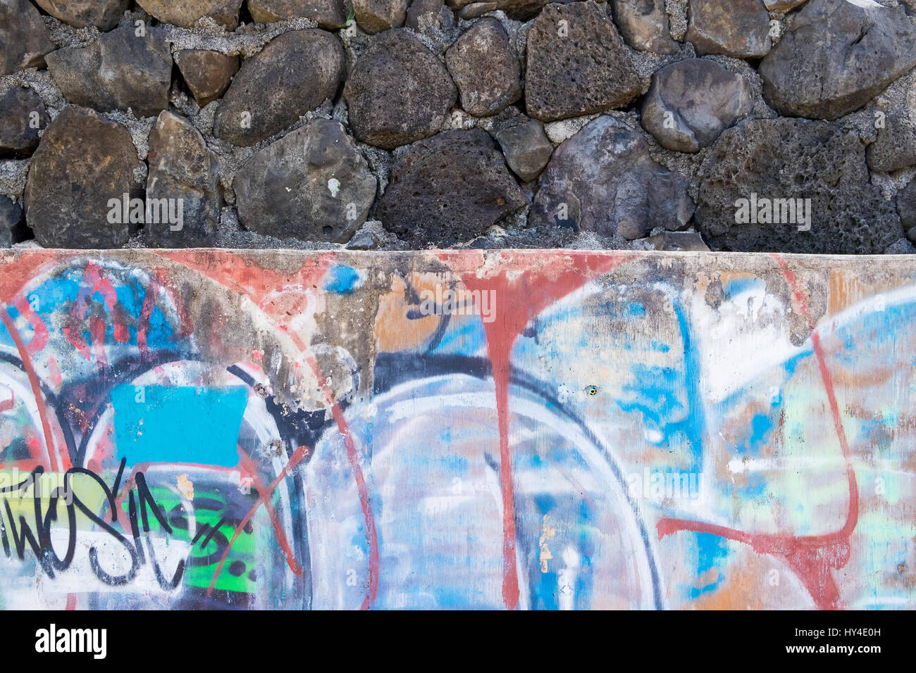 Old graffiti on a cement wall has a very unique texture after years and ...