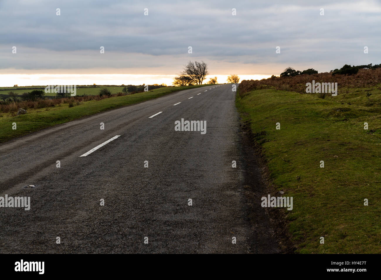 Small UK country road looking towards west at sunset Stock Photo - Alamy