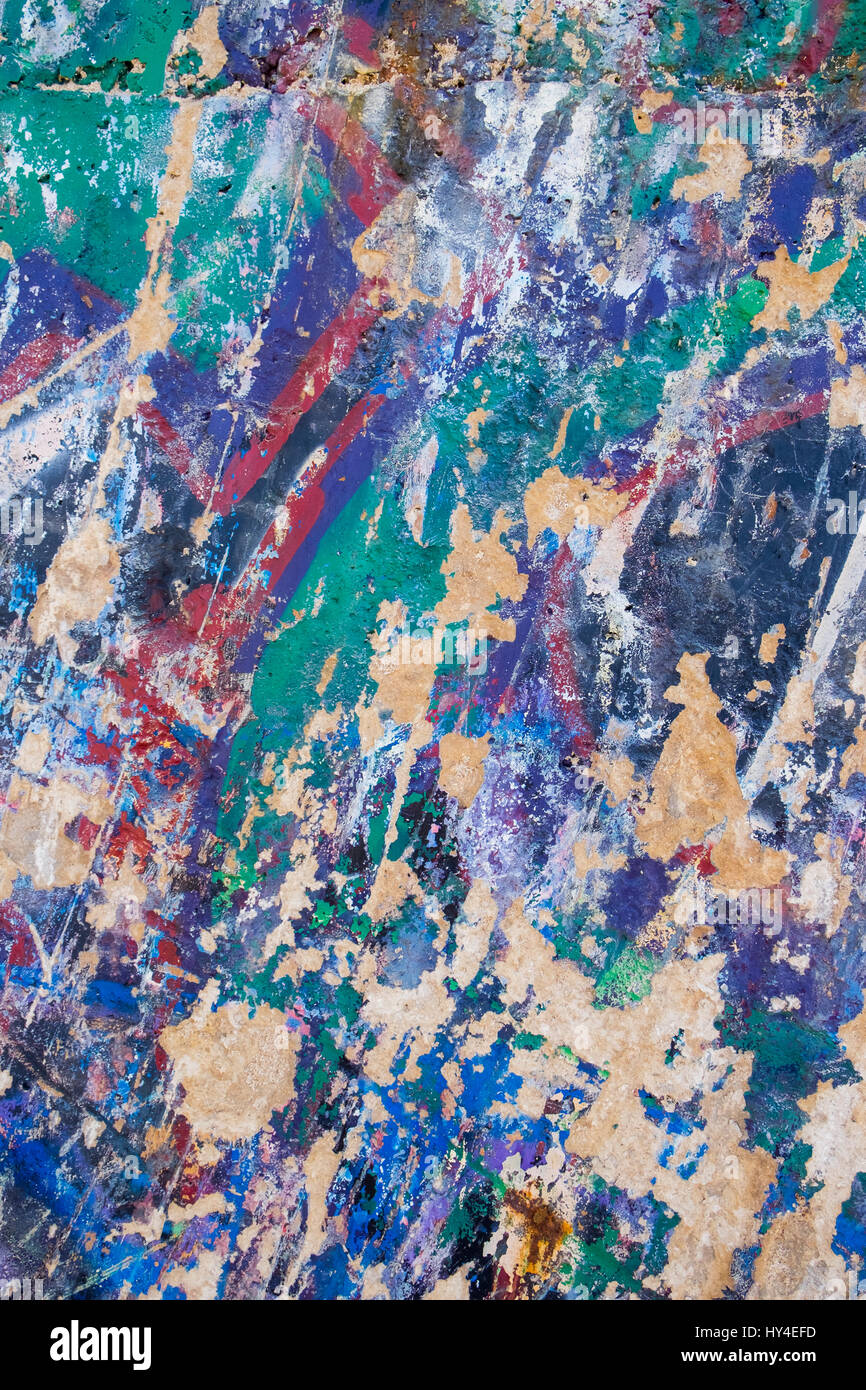 Old graffiti on a cement wall has a very unique texture after years and ...