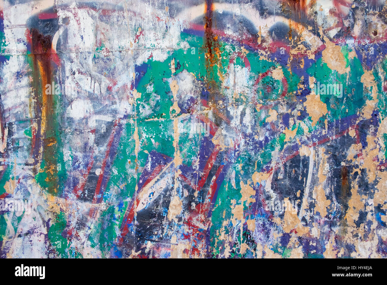 Old graffiti on a cement wall has a very unique texture after years and ...