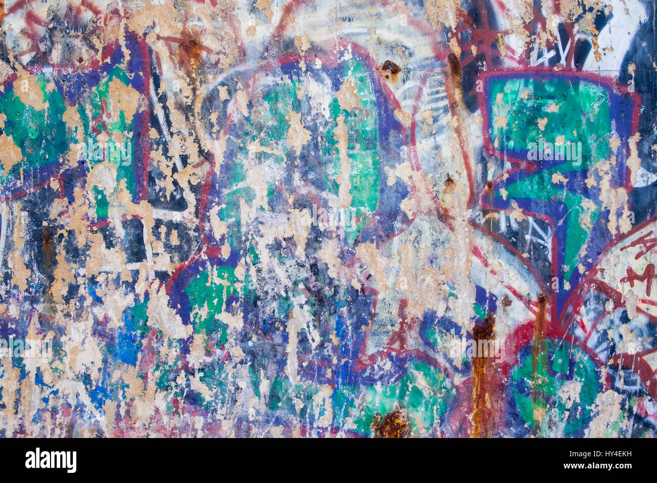 Old graffiti on a cement wall has a very unique texture after years and ...