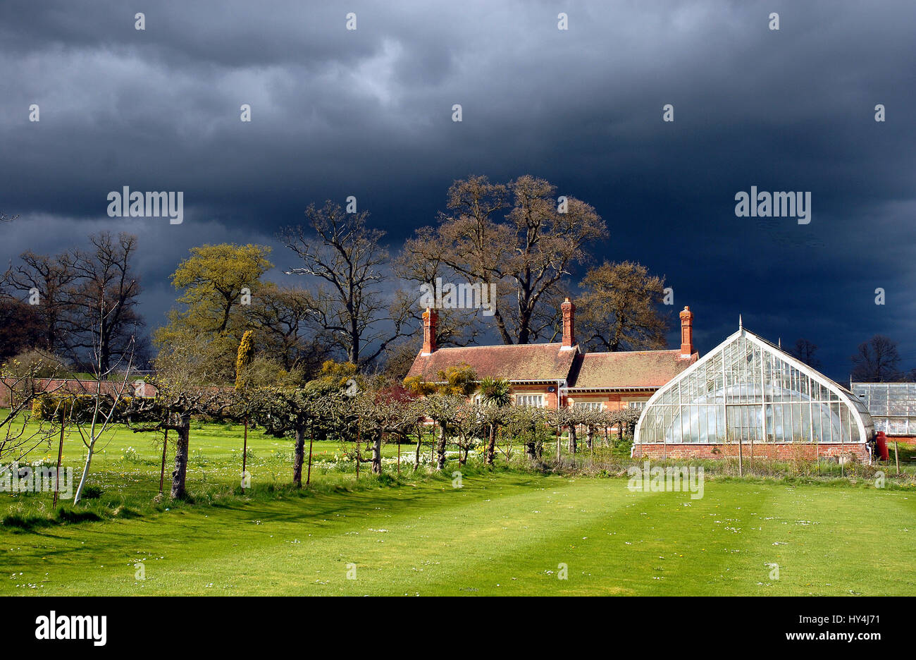 Grimsthopre Castle kitchen gardens with storm clouds and unusual boat ...