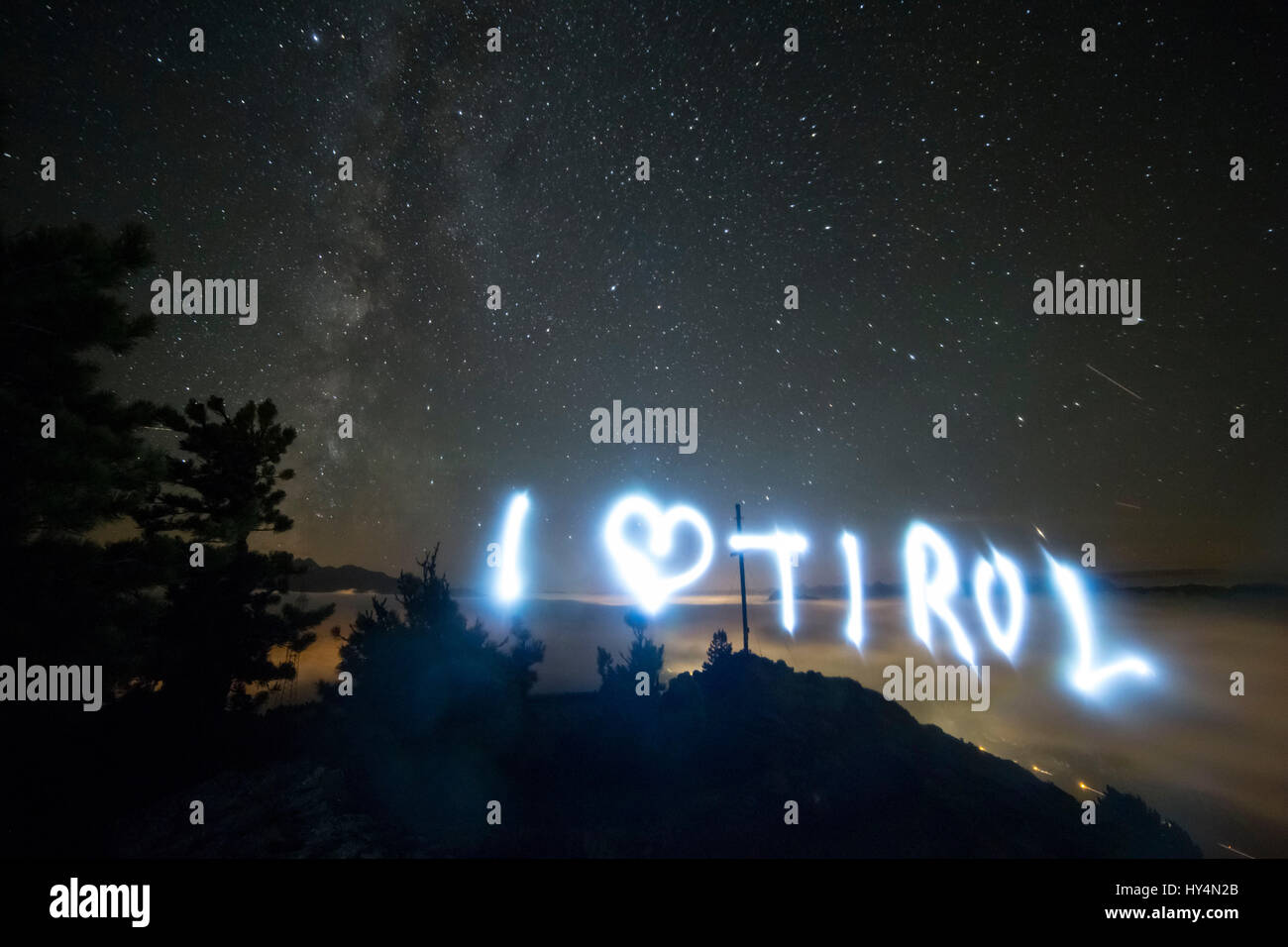 Light Painting 'I love Tirol' with the Milky Way and the summit cross ...