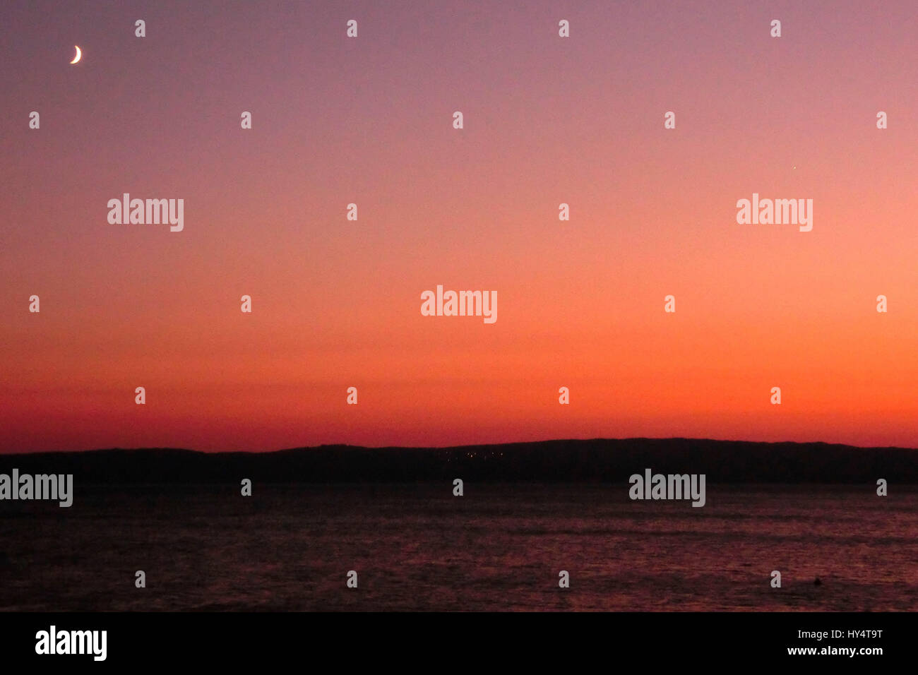 The moon at dusk Stock Photo - Alamy