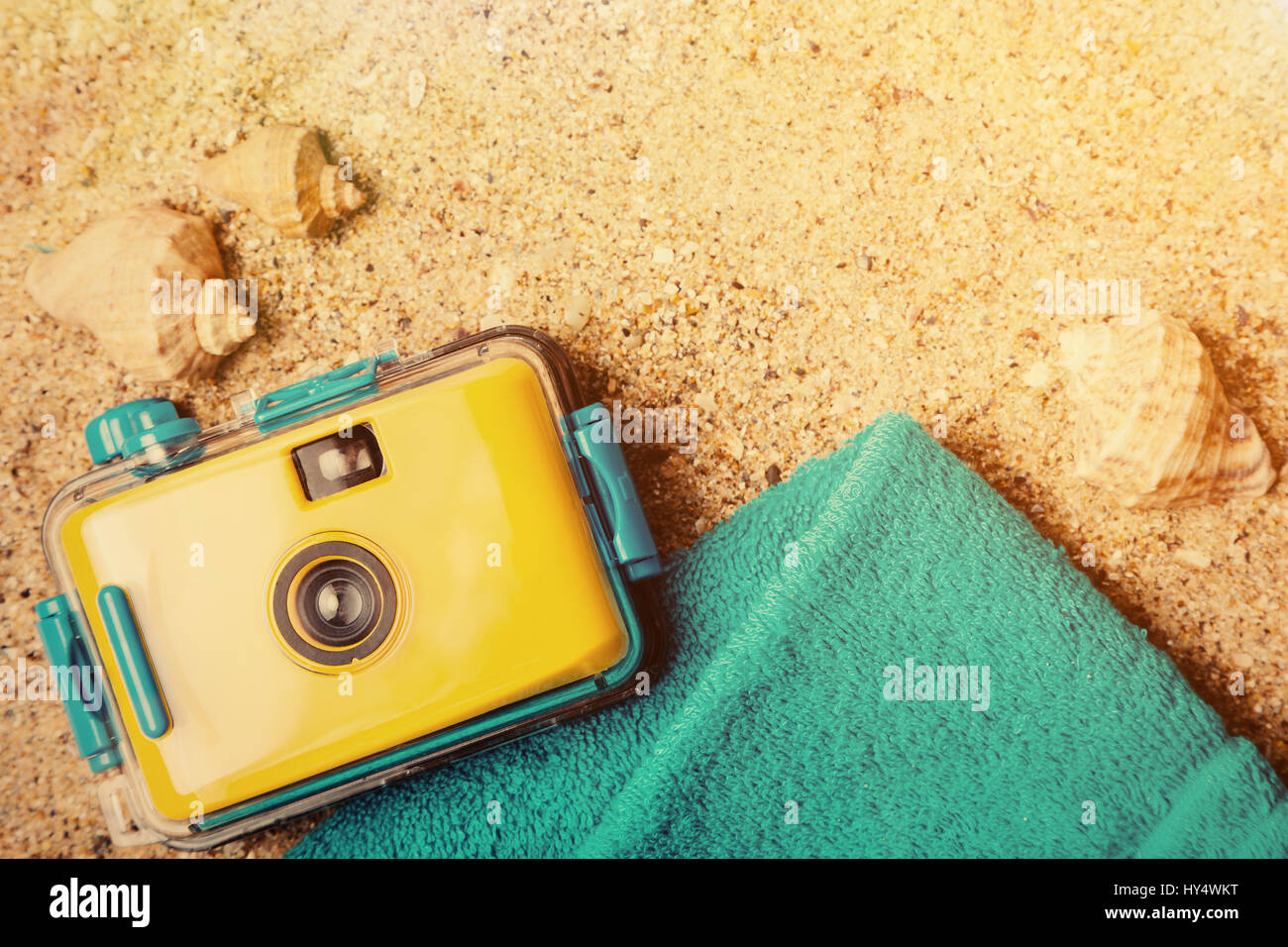 Travel camera and summer accessories on beach. Summertime concept with ...