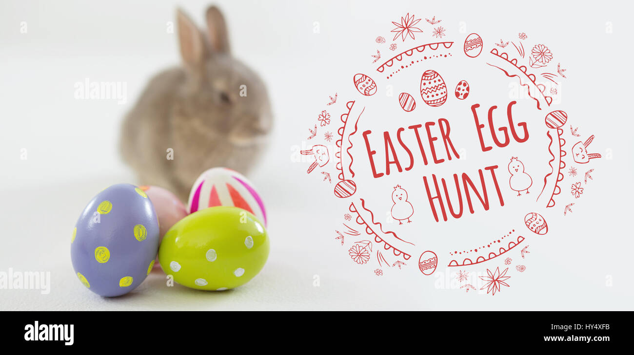 Easter Egg Hunt logo against white background against easter eggs and ...