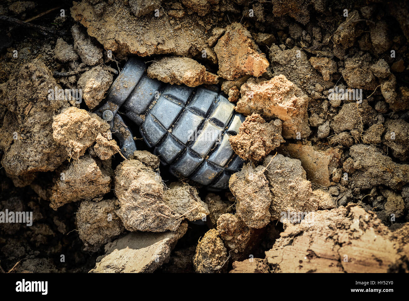 Grenade in the ground, Handgranate im Boden Stock Photo - Alamy