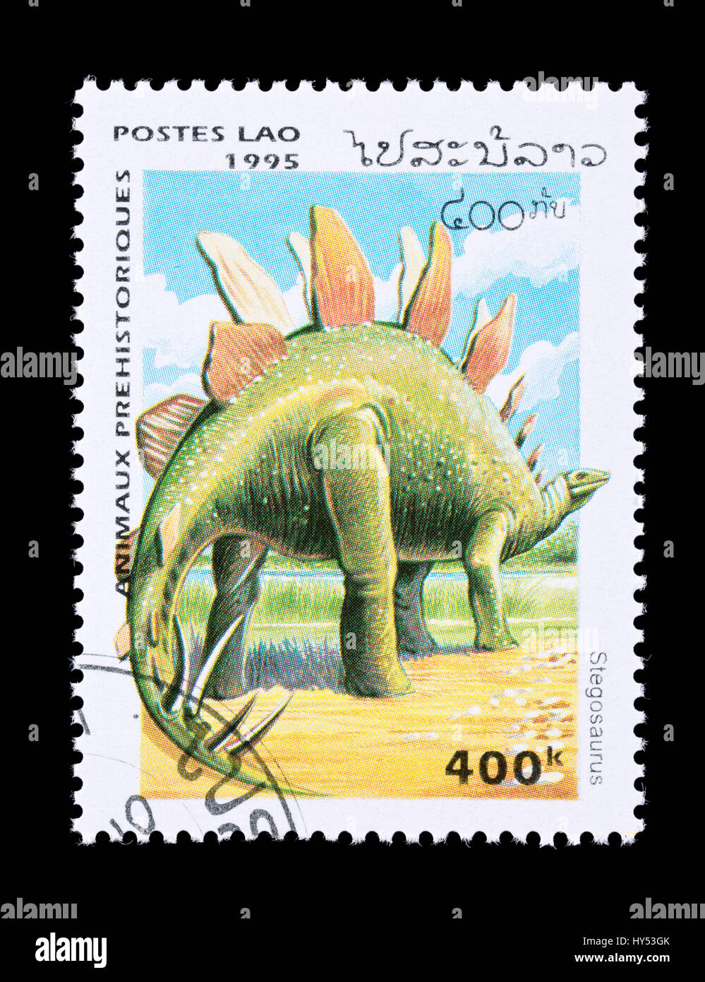 Postage stamp from Laos depicting a stegosaurus dinosaur Stock Photo ...