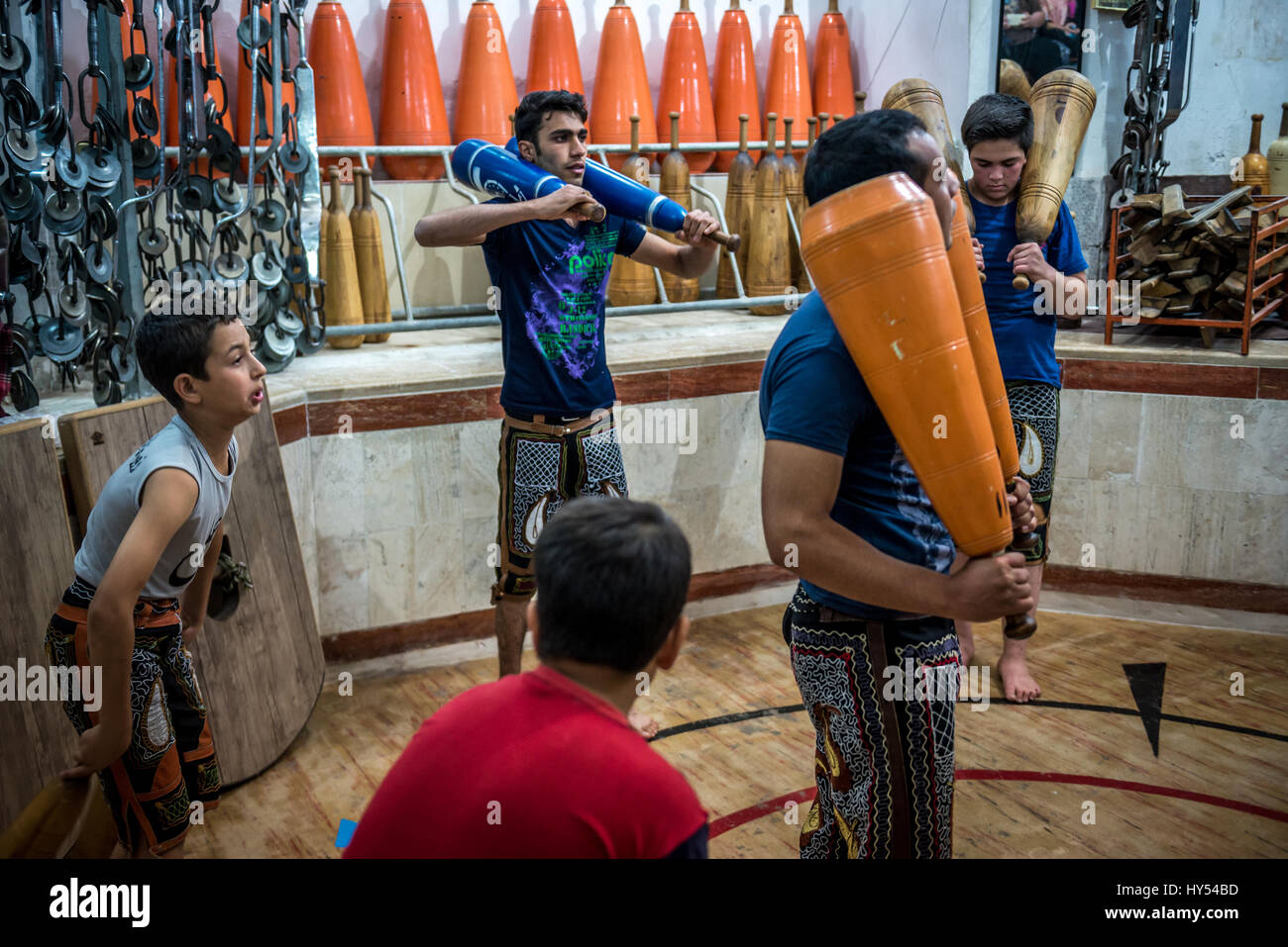 Iranian men and boys training with wooden clubs in Zoorkhaneh (House of ...