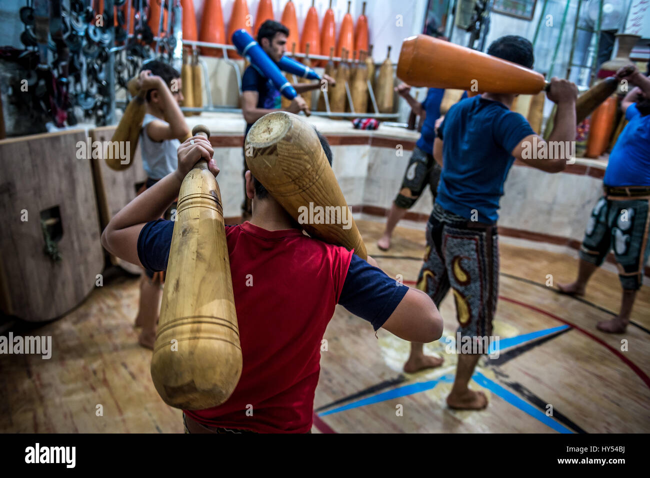 Iranian men and boys training with wooden clubs in Zoorkhaneh (House of ...