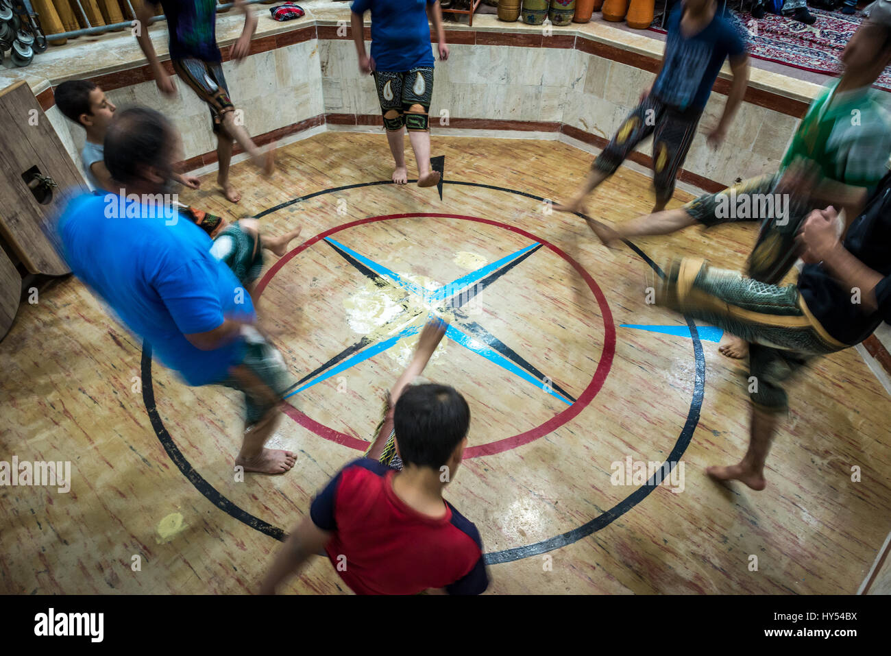 Iranian men and boys training in Zoorkhaneh (House of Strength ...