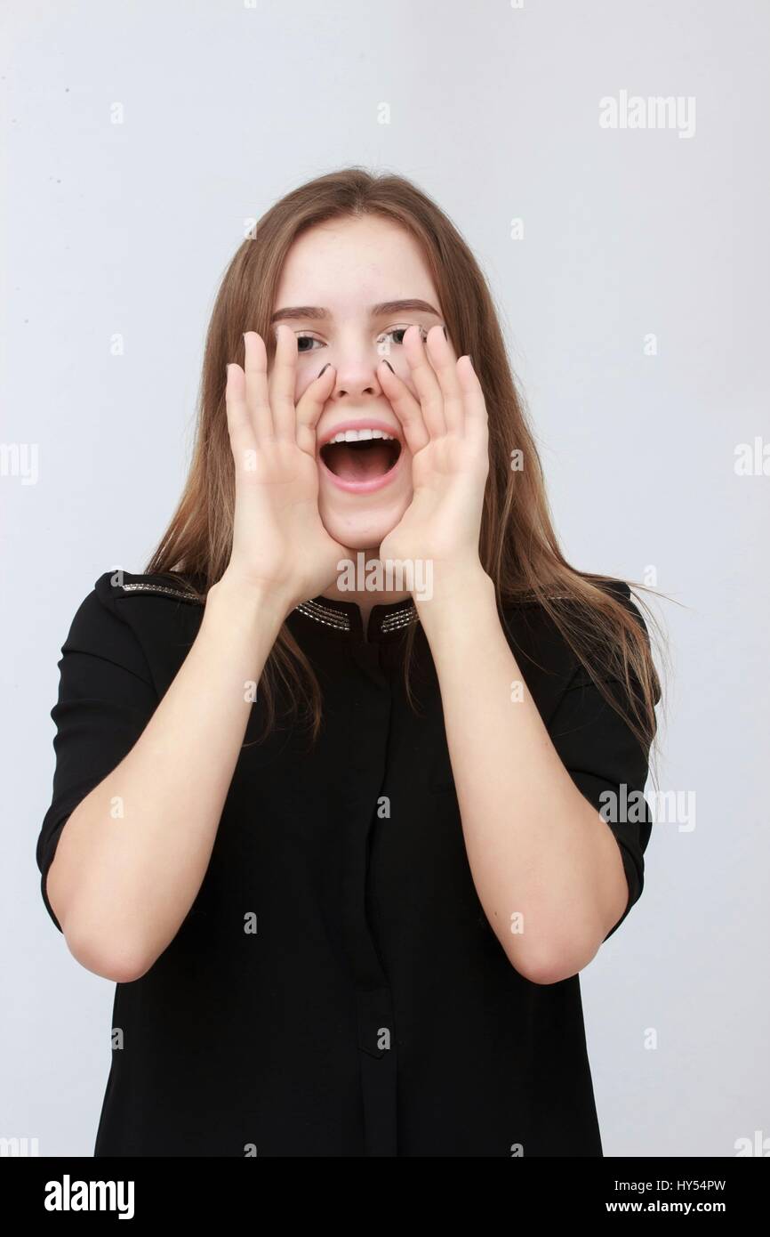 Beautiful young woman shouting, isolated over a white background Stock ...