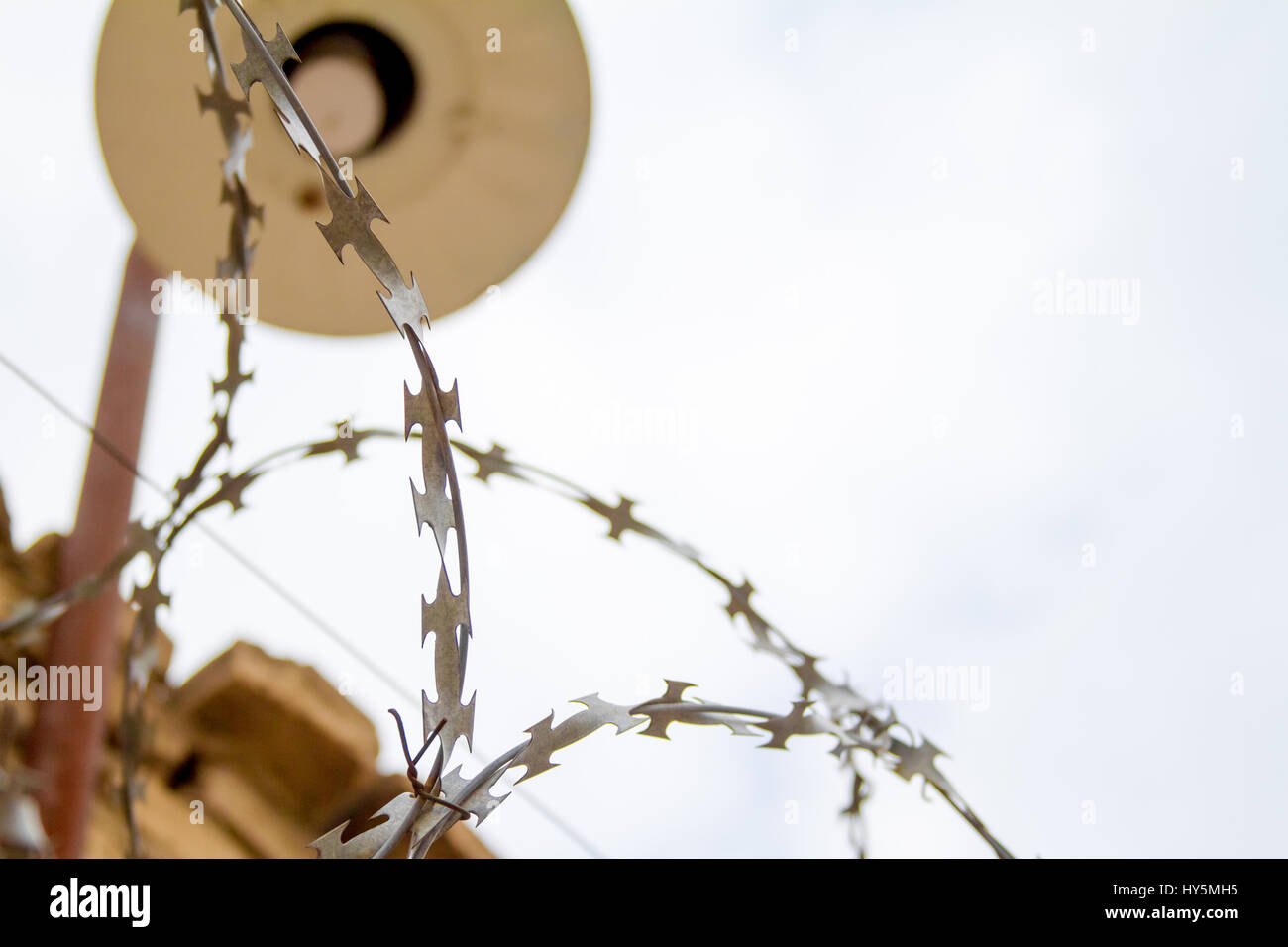 Barbed wire on sky background Stock Photo - Alamy