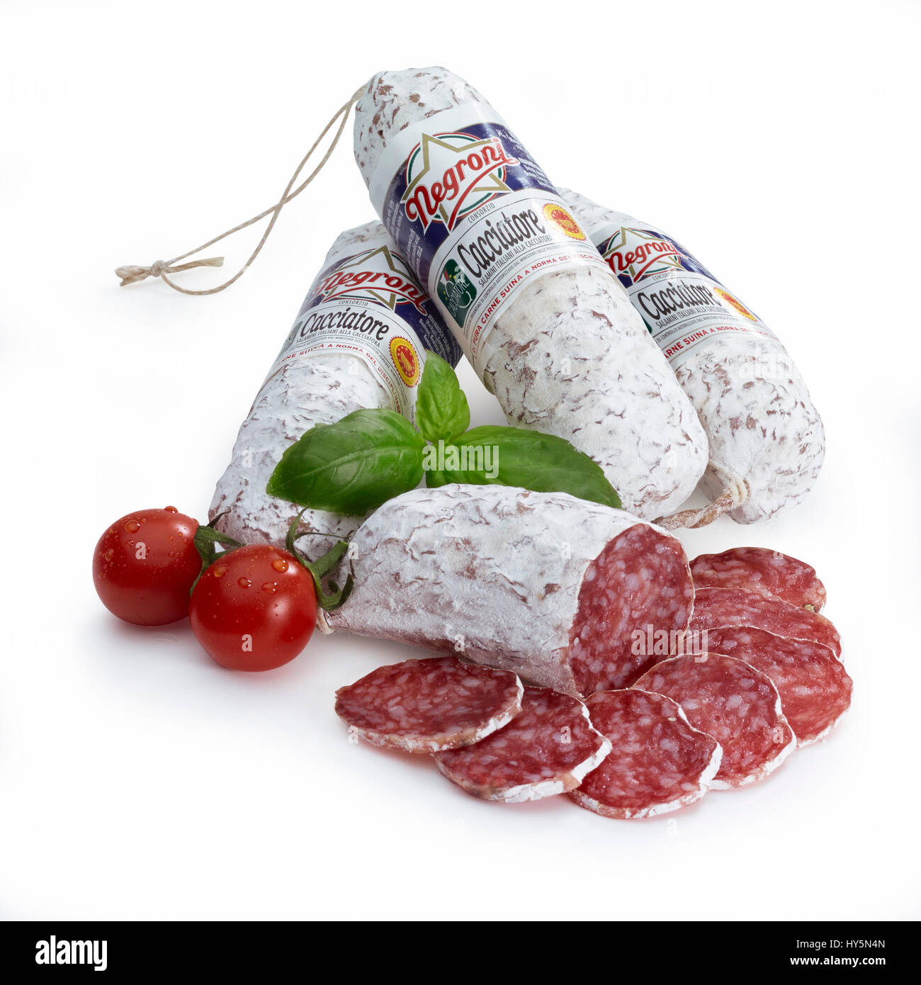 Salami Cacciatore, partially cut, (Solanum lycopersicum) with tomatoes ...