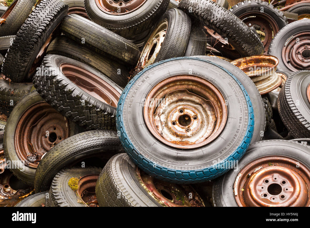 Old, rusty car tires, car scrap yard, Bastnäs, Varmland, Sweden Stock ...
