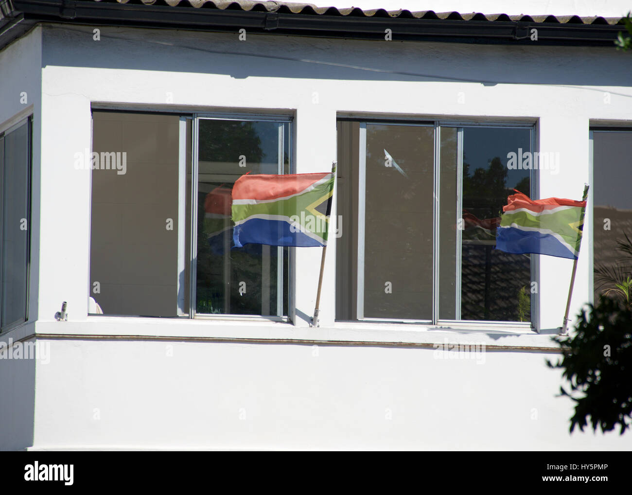 South african flags flying on a building in simons town hi-res stock ...