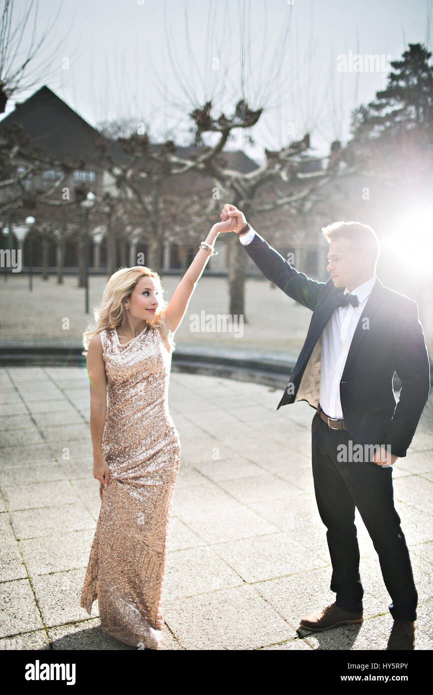 Glamorous couple, happy, in love, dancing Stock Photo - Alamy