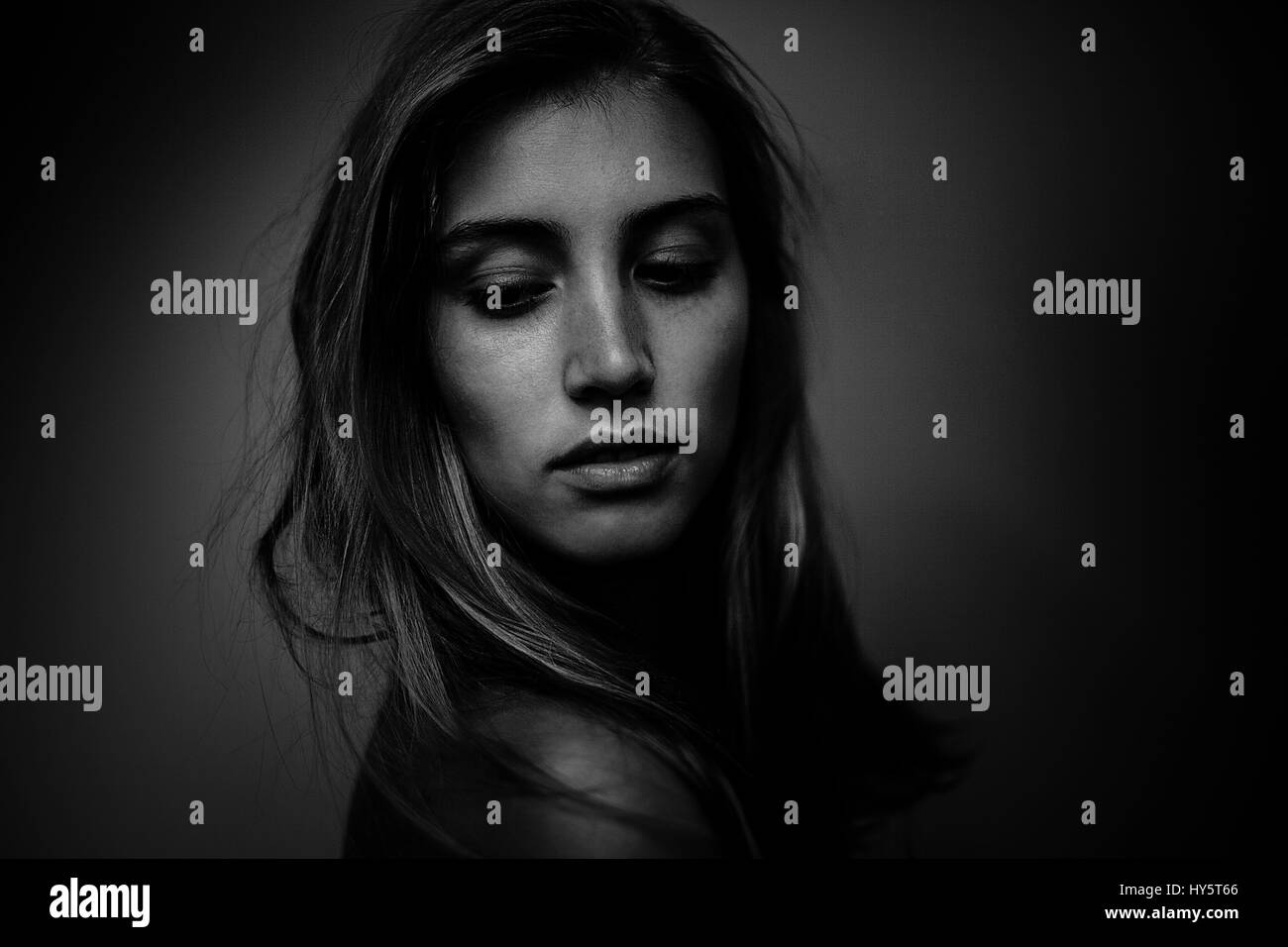 Gloomy portrait of a young woman Stock Photo - Alamy