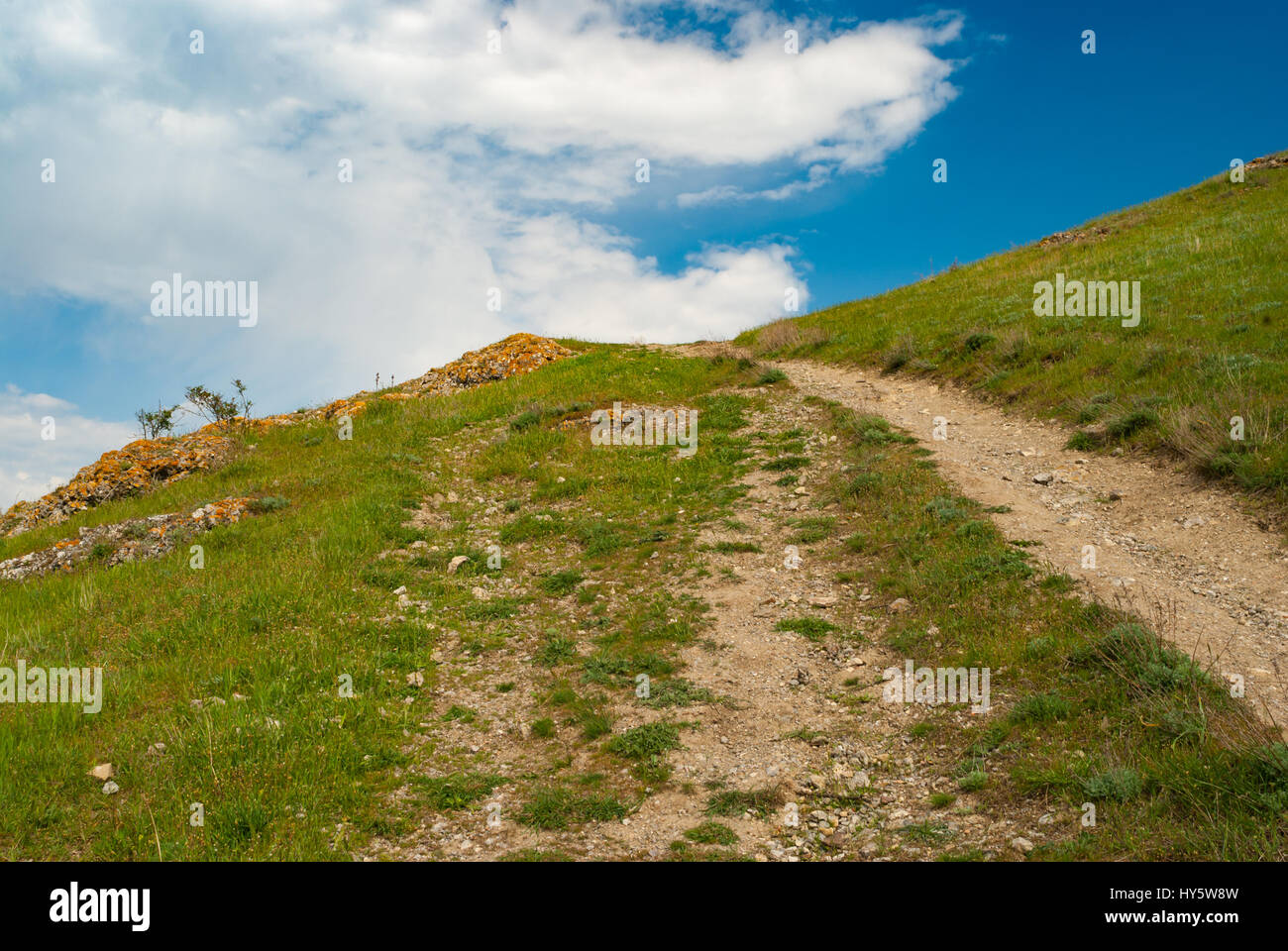 Empty hiking path to uplands in spring mountains Stock Photo - Alamy