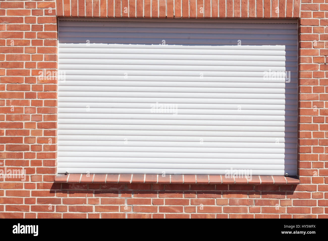 Windows with closed shutters on a red House Wall Stock Photo - Alamy