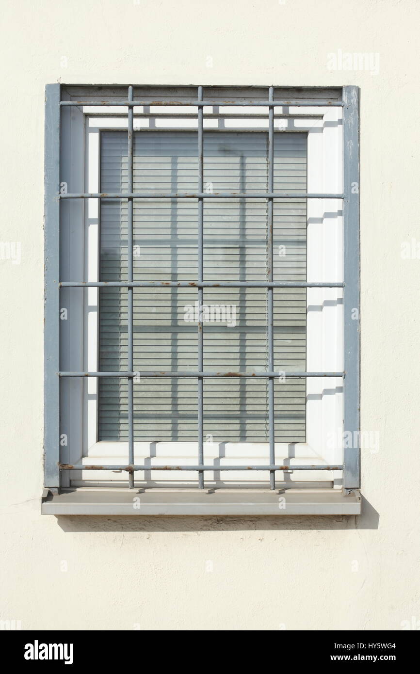 Window with grids and pulled down shutters Stock Photo - Alamy