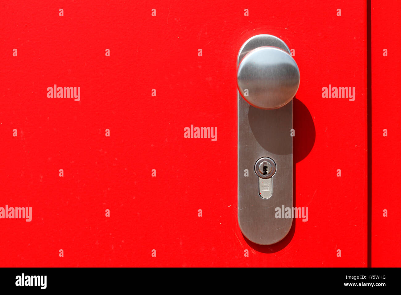 red metal Door and silver matal door lock Stock Photo - Alamy