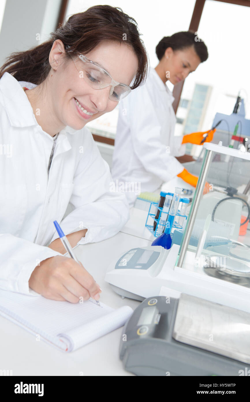 Laboratory technician taking notes Stock Photo - Alamy