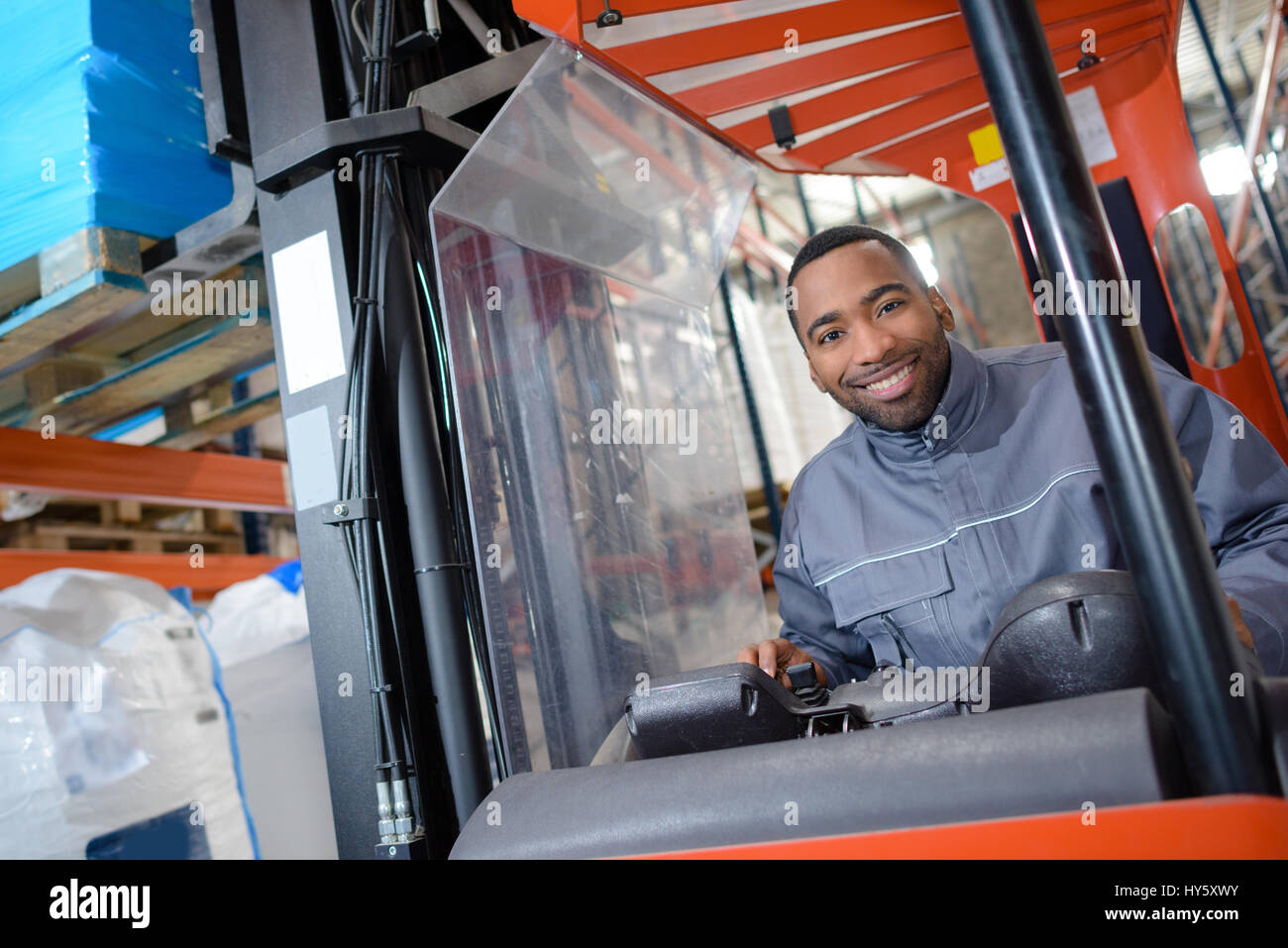 Portrait of man in forklift truck Stock Photo - Alamy