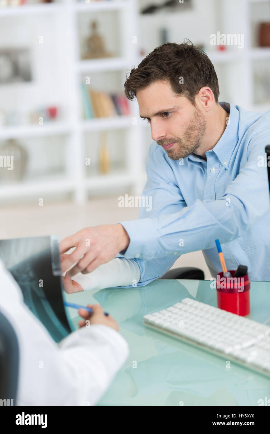 young patient during consultation in doctors office Stock Photo - Alamy