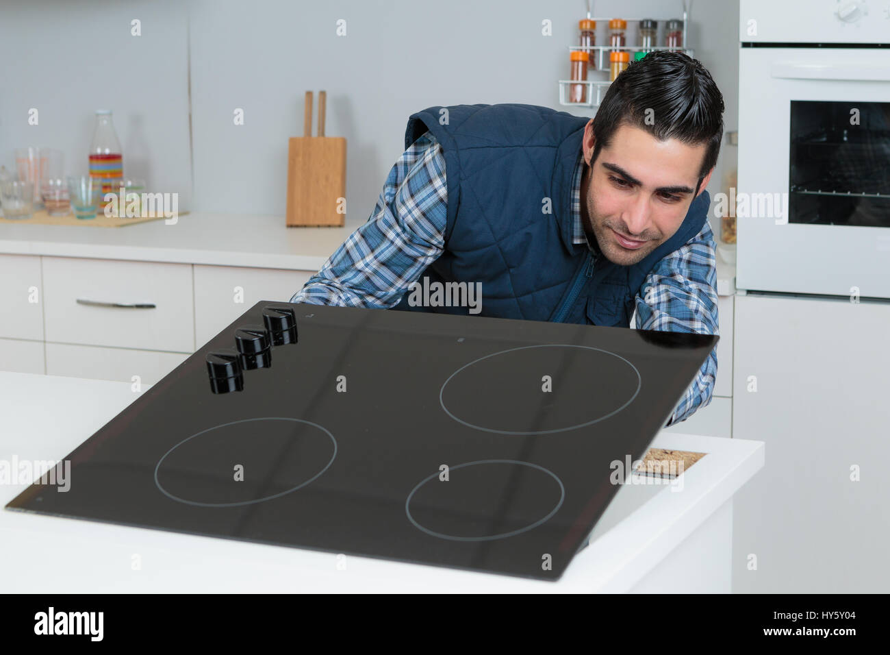 fitting the hob Stock Photo - Alamy