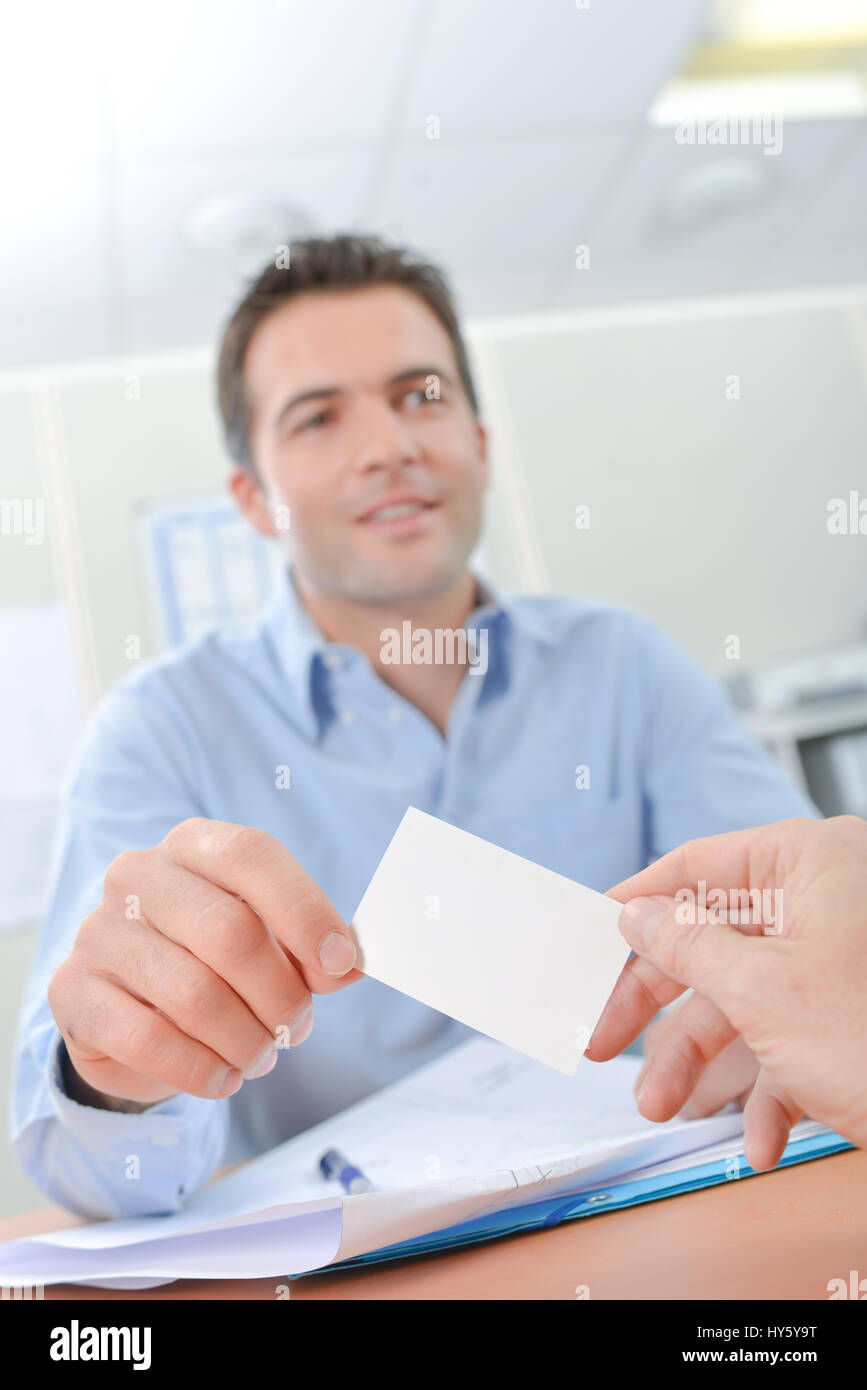 Male hand passing business card hi-res stock photography and images - Alamy
