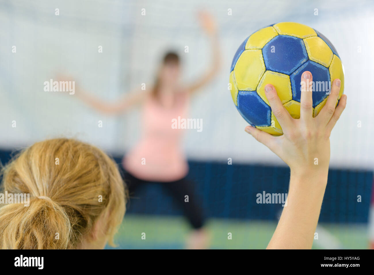 Woman playing handball Stock Photo - Alamy