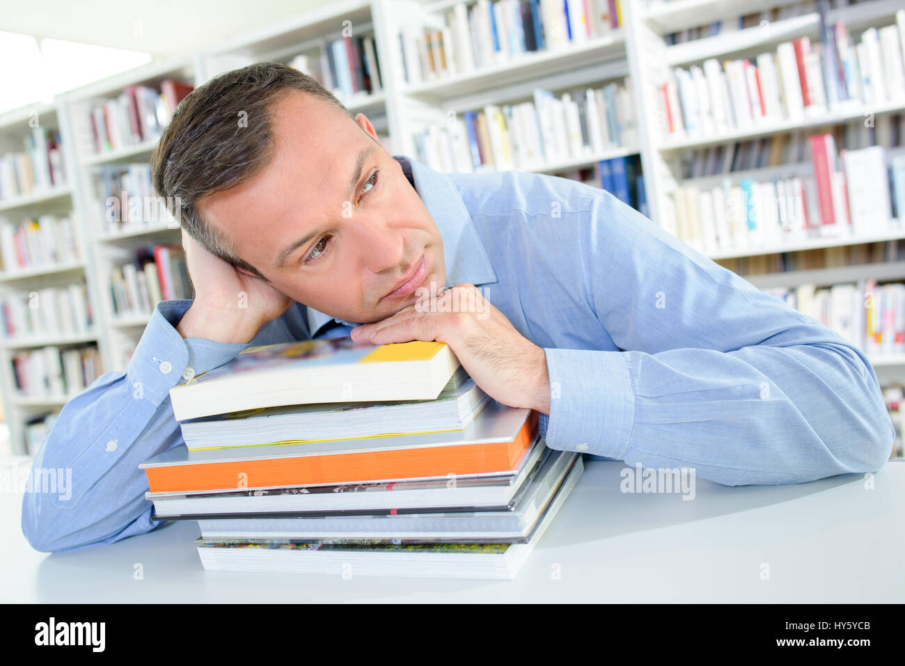Head slumped on table hi-res stock photography and images - Alamy
