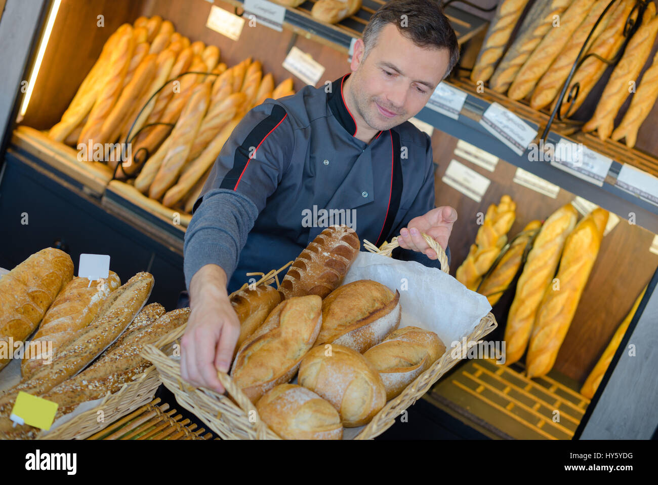 bakery shopkeeper is proud of his bread production Stock Photo - Alamy