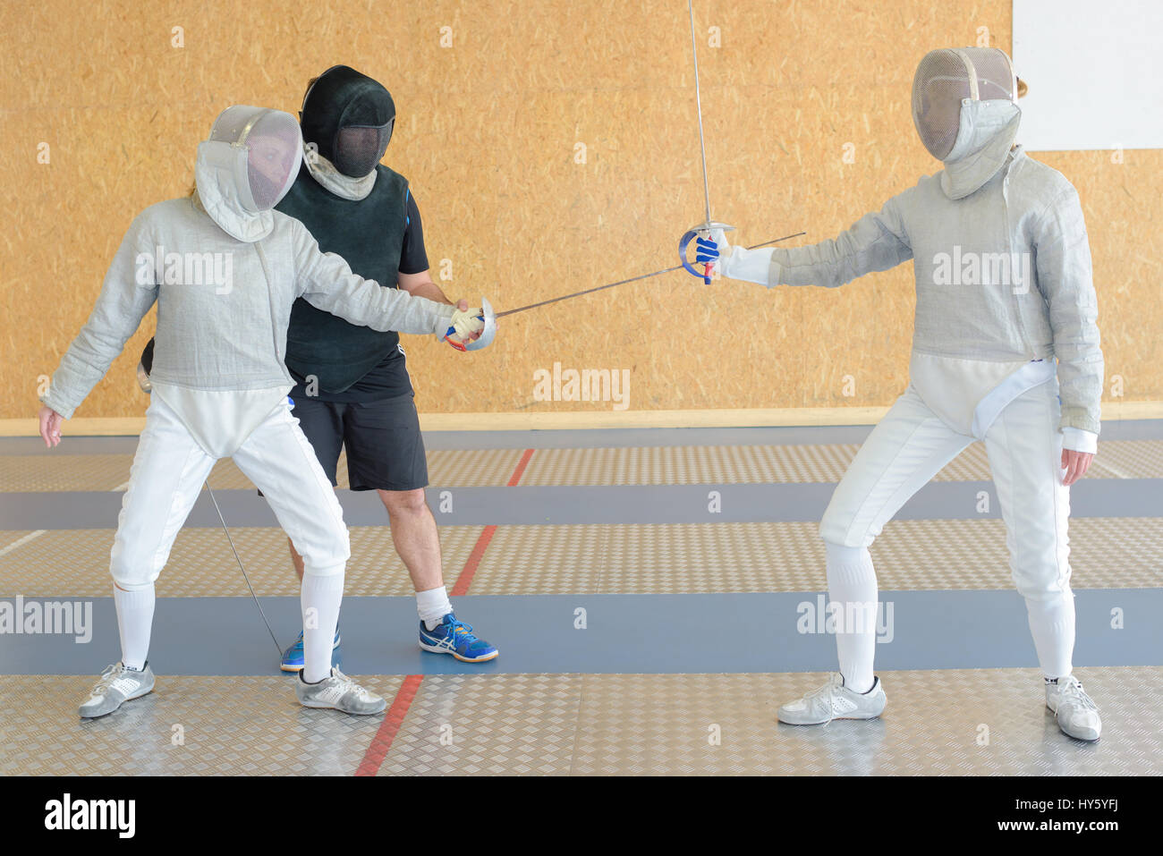 three fencers on a practice Stock Photo - Alamy